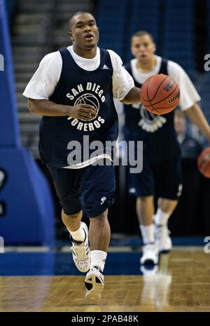 San Diego guard Brandon Johnson (1) makes a basket over Gonzaga's Bol ...