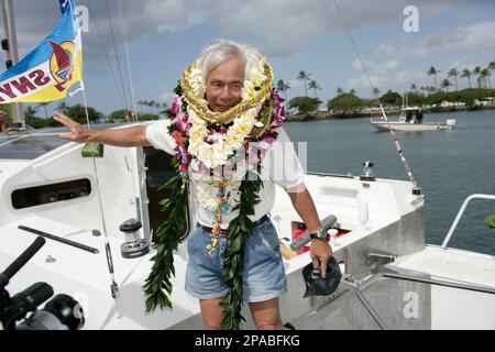 Ken-ichi Horie, of Japan, stands aboard his wave powered boat, the ...