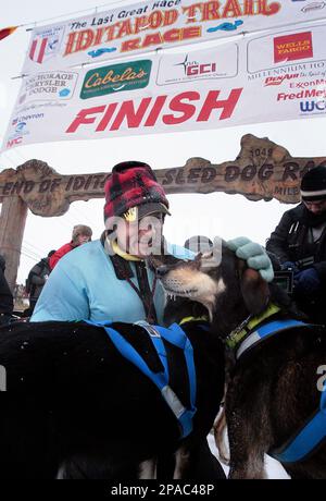 Four-time Iditarod champion Martin Buser drives his team off of the ...