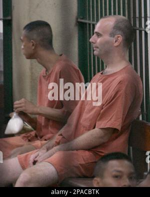 Canadian Christopher Paul Neil sits in the cell at criminal court in ...