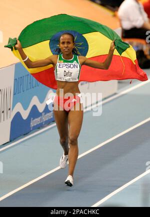 Ethiopia's Meseret Defar celebrates her gold medal finish in the women ...