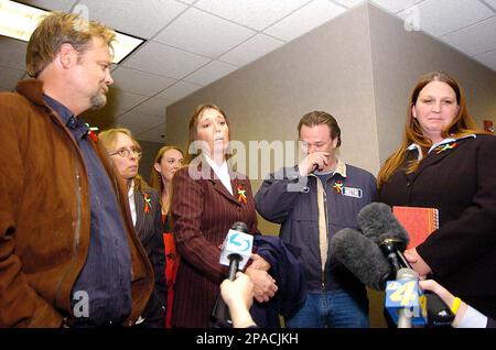 Jamie Bolin's mother Jennifer, left, hugs juror Claudette Brumit ...