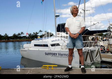Ken-ichi Horie, of Japan, stands aboard his wave powered boat, the ...