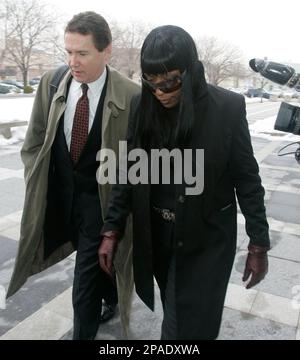 Tamika Riley, right, arrives at the U.S. District Courthouse in Newark ...
