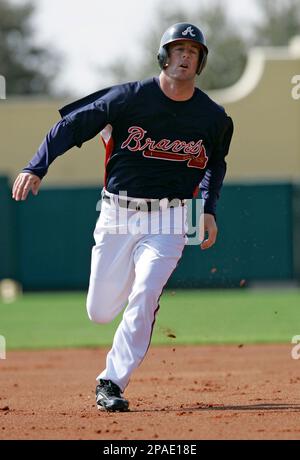Atlanta Braves pitcher Jeff Ridgway, left, tries to throw out Cleveland ...