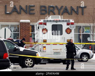 Authorities seen investigating the crime scene. Two people were killed ...