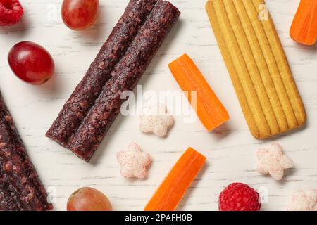 Flat lay composition with different finger foods for baby on white ...
