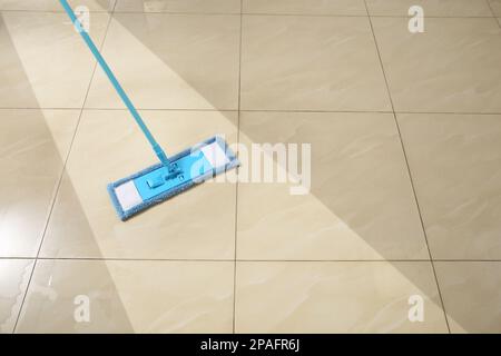 Washing of floor with mop. Difference before and after cleaning Stock ...