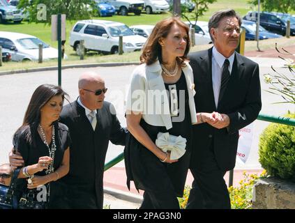 (left to right) Sally Bell, Kim Ledger and Kate Ledger accept Heath ...