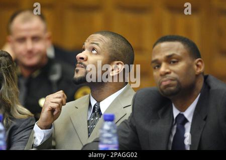 Former Canton police officer Bobby Cutts Jr., left, along with his ...