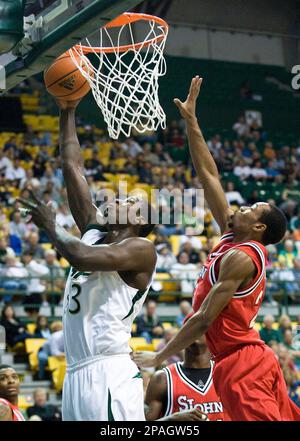 St.John's guard Paris Horne, right, knocks the ball loose from the ...