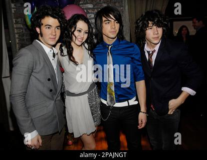 Miley Cyrus, left, star of the film "Hannah Montana & Miley Cyrus: Best ...