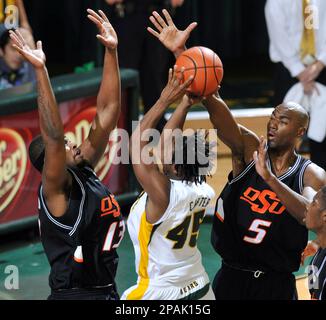 Baylor's Tweety Carter (45) drives around Nebraska's Jay-R Strowbridge ...