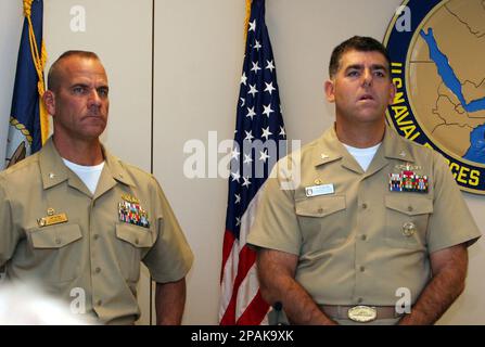 US Navy Captain David Adler, right, and Commander Jeffery James, left ...