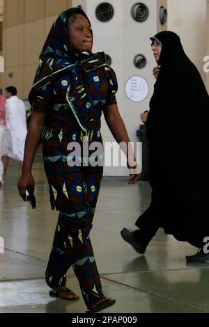 Nigerian female Muslim pilgrim after she arrived at the airport of ...