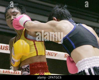 Japanese champion Momo Koseki, right, sends a left to Philippine ...