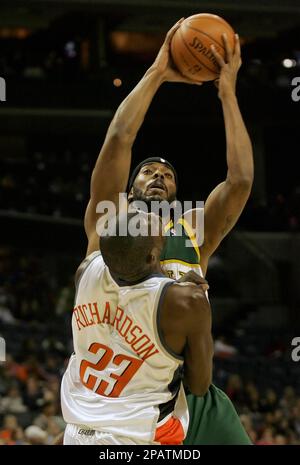 Charlotte Bobcat's Jason Richardson (23) drives to the basket as Utah ...