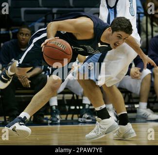 San Diego guard Devin Ginty, left, tries to get by Gonzaga's G.J ...