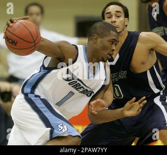 San Diego guard Brandon Johnson (1) makes a basket over Gonzaga's Bol ...