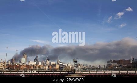 A construction site after a warehouse fire, burnt structures. Storage ...