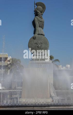 Athena God statue against blue sky Stock Photo - Alamy