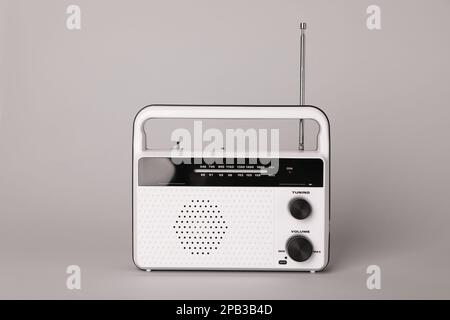 Retro radio receiver on grey background Stock Photo - Alamy