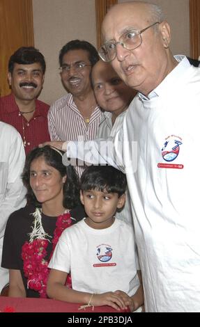American astronaut Sunita Williams and her father Deepak Pandya wave to ...