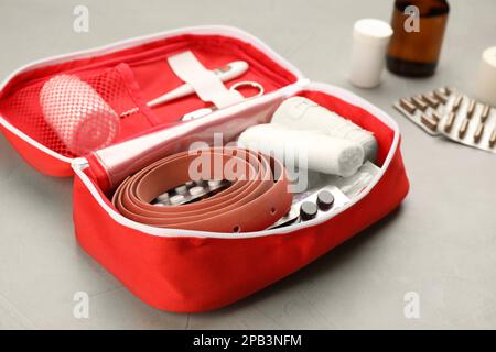 First aid kit on grey background Stock Photo - Alamy