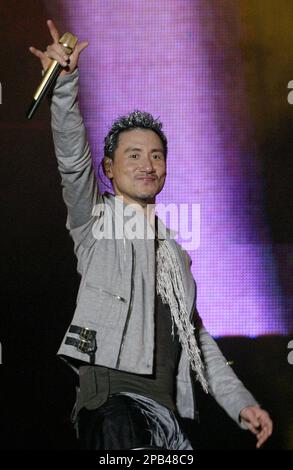 Hong Kong Cantopop star Jacky Cheung performs with dancers during his ...