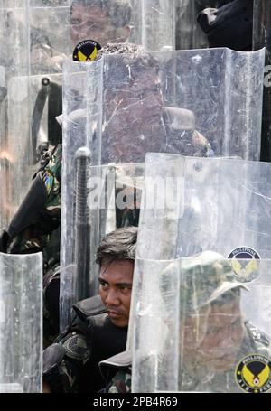 Philippine Armed Forces Chief Gen. Hermogenes Esperon Jr. shows a photo ...