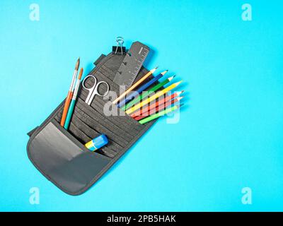 A top view closeup of a ruler, pencils, eraser, cutter, notebook, on ...