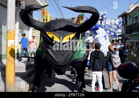 08 March 2023, Tultepec, Mexico: Persons attend monumental cardboard ...