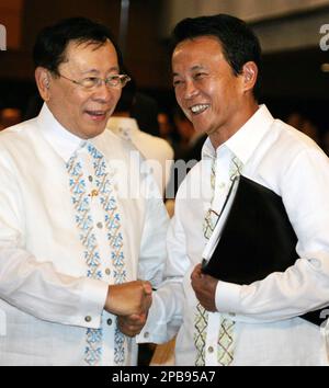 Philippine Foreign Secretary Alberto Romulo, left, greets U.S ...