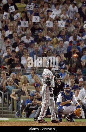 Fans hold "asterisk" signs as San Francisco Giants' Barry Bonds comes ...