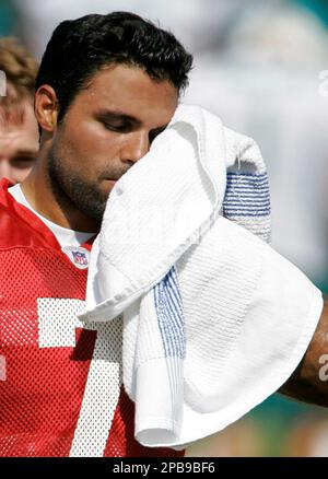 Miami Dolphins quarterback Gibran Hamdan, left, prepares to pass as ...