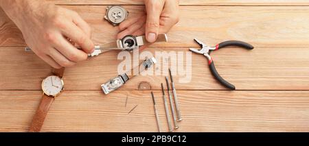 hands of a man while repairing watches. Watchmaker at work Stock Photo ...