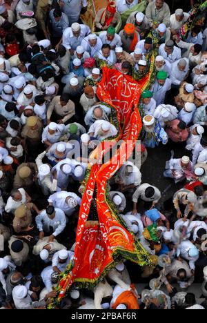 Pakistani Pilgrims offer 'Holy Chadar' at the shrine of Sufi saint Hazrat Khwaja Moinuddin ...