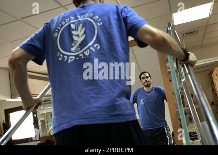 Israeli Army Lt.Asael Lubotzky, 24, is seen sit on the bed before he ...