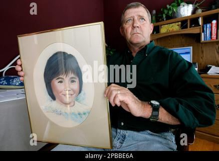 Jerry Ensminger holds a portrait of his daughter Janey in White Lake, N ...