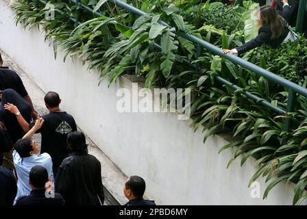 Mazlinda Abdul Razak, wife of Abdul Razak baginda, center, dejected ...