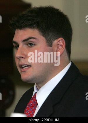 Former Duke lacrosse player Reade Seligmann, left, is guided into court ...