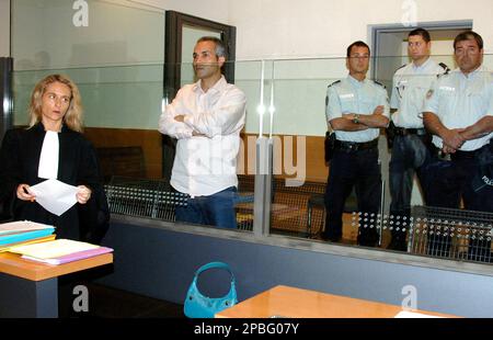 Suspect Mohammed M'Barek stands at the start of his trial in a Nice ...