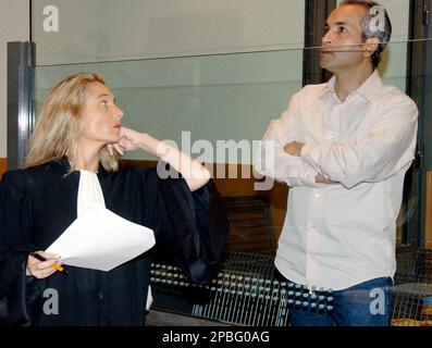 Suspect Mohammed M'Barek stands at the start of his trial in a Nice ...