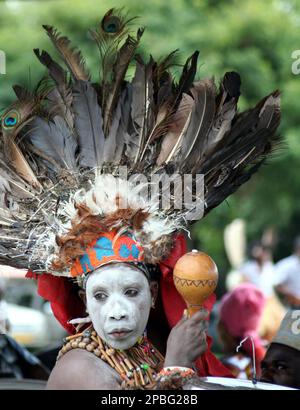 A performer wearing traditional attire during the Lok Mela festival in ...