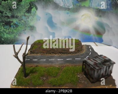 a close up of a diorama of a rice field scene and an old roadside house ...