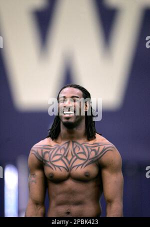 Former Washington quarterback Isaiah Stanback makes a phone call before ...