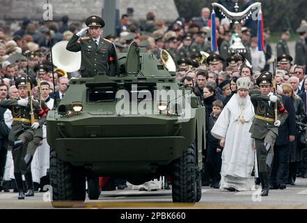 The armored reconnaissance vehicle tows the caisson with the flag ...