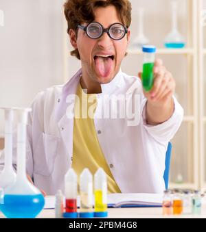 Funny crazy chemist doing experiments and tests Stock Photo - Alamy