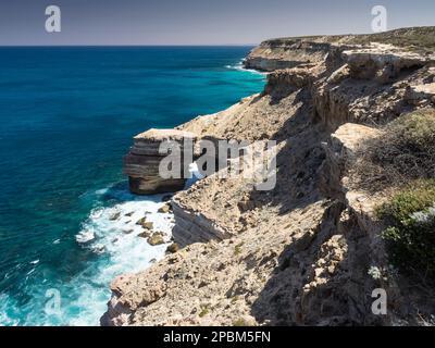 Crumbling limestone clifftops above the relentless Indian Ocean ...