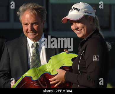 Brittany Lincicome, right, holds the winner's trophy with The Ginn ...